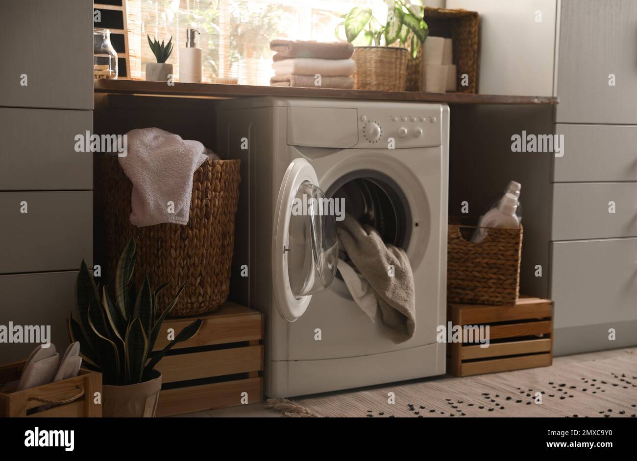Stylish room interior with washing machine. Design idea Stock Photo - Alamy