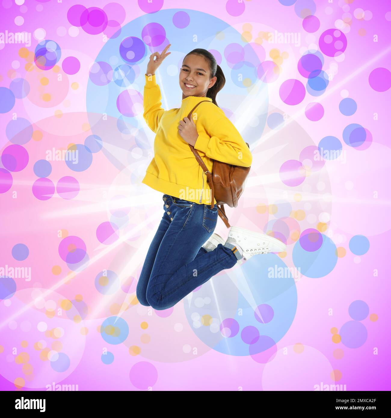 Teenager jumping on colorful background. School holidays Stock Photo ...