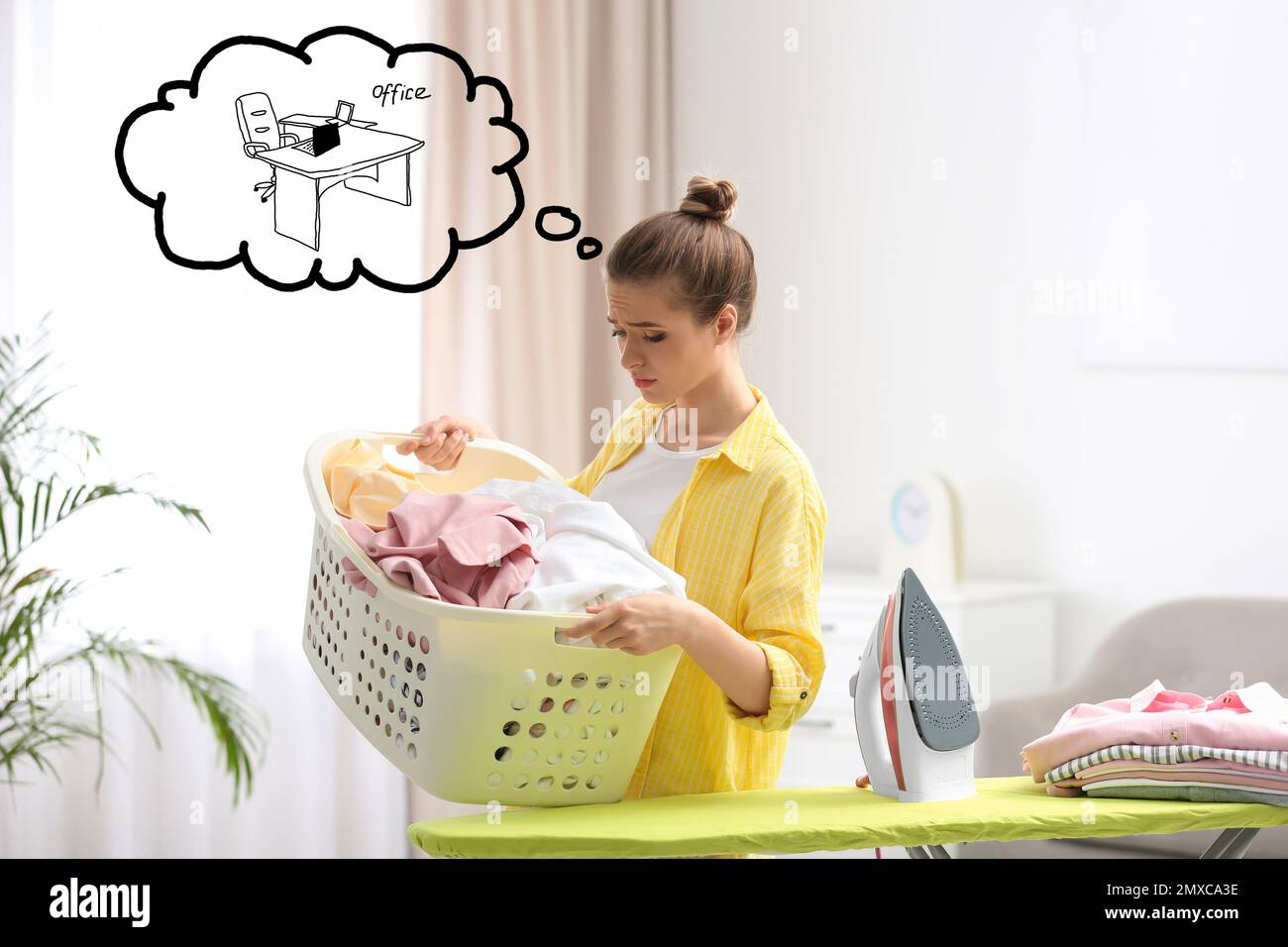 Sad young office woman with laundry basket at home hi-res stock ...