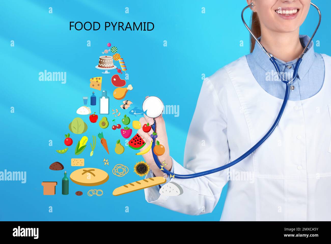 Nutritionist and food pyramid on light blue background, closeup Stock ...