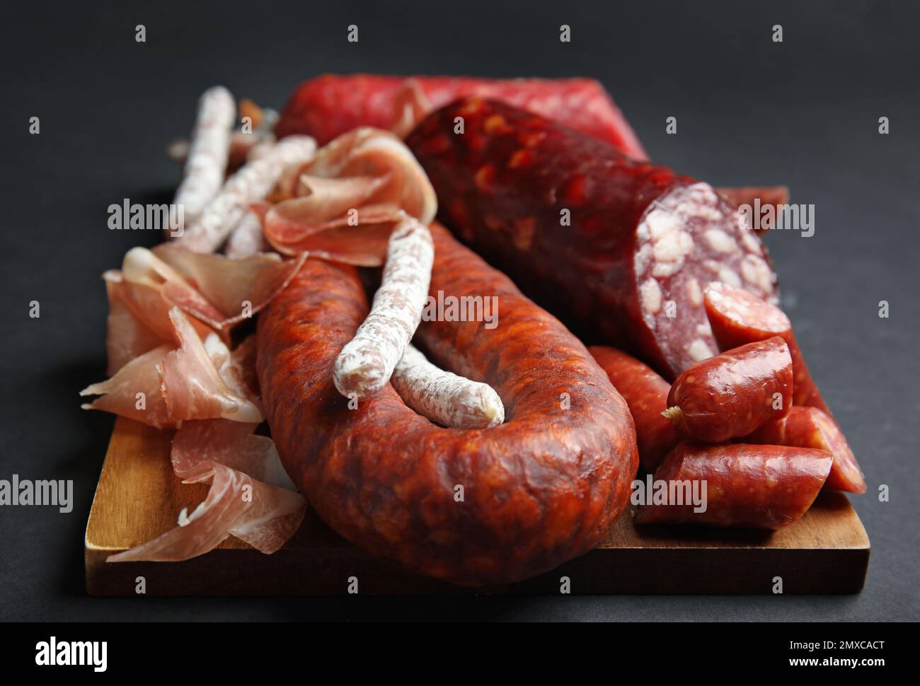 Different types of sausages served on black background, closeup Stock ...