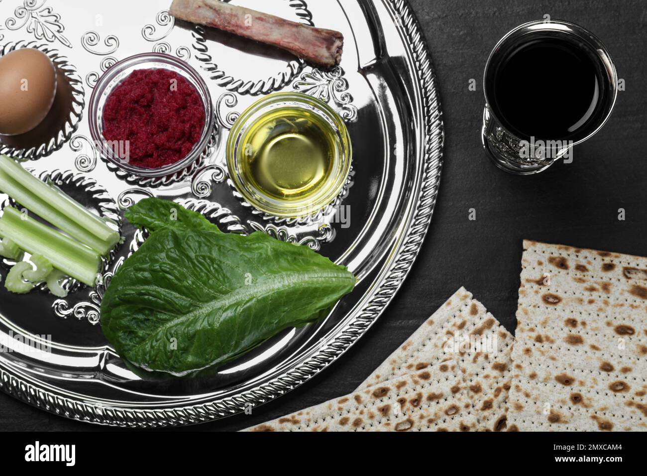 Flat lay composition with Passover Seder plate (keara) on black table ...