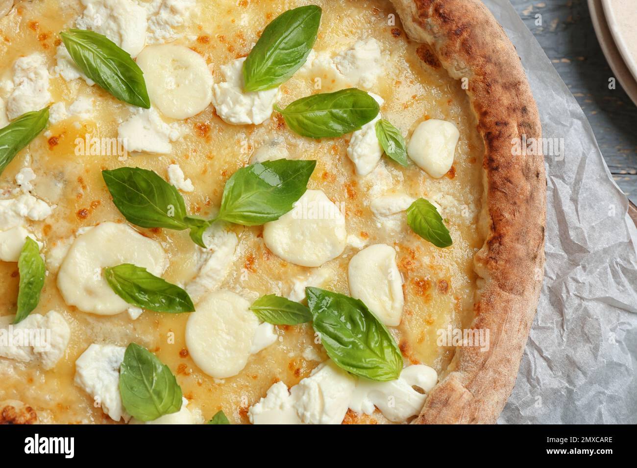 Delicious hot cheese pizza with basil on table, top view Stock Photo ...