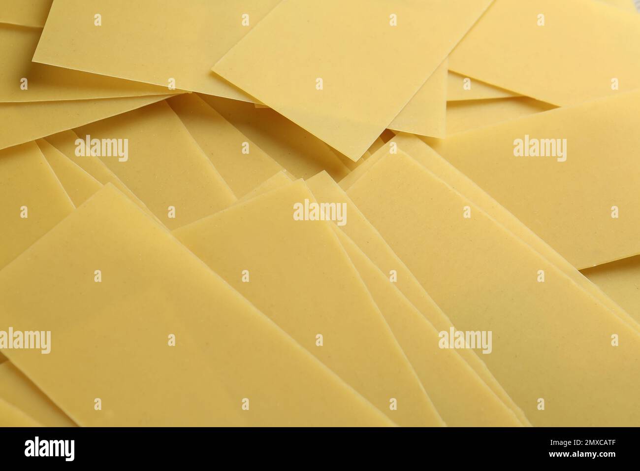 Pile of dry lasagna sheets as background, closeup Stock Photo - Alamy