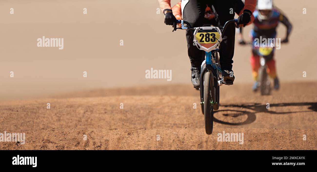 BMX riders competing in the child class on the off-road circuit Stock ...