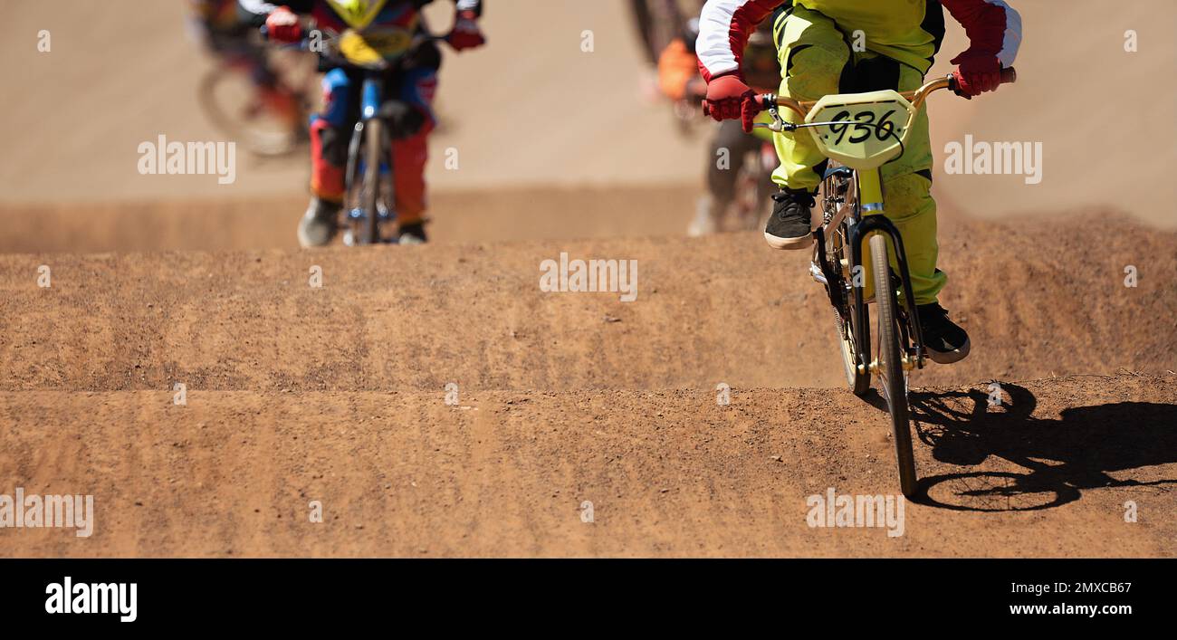 BMX riders competing in the child class on the off-road circuit Stock ...