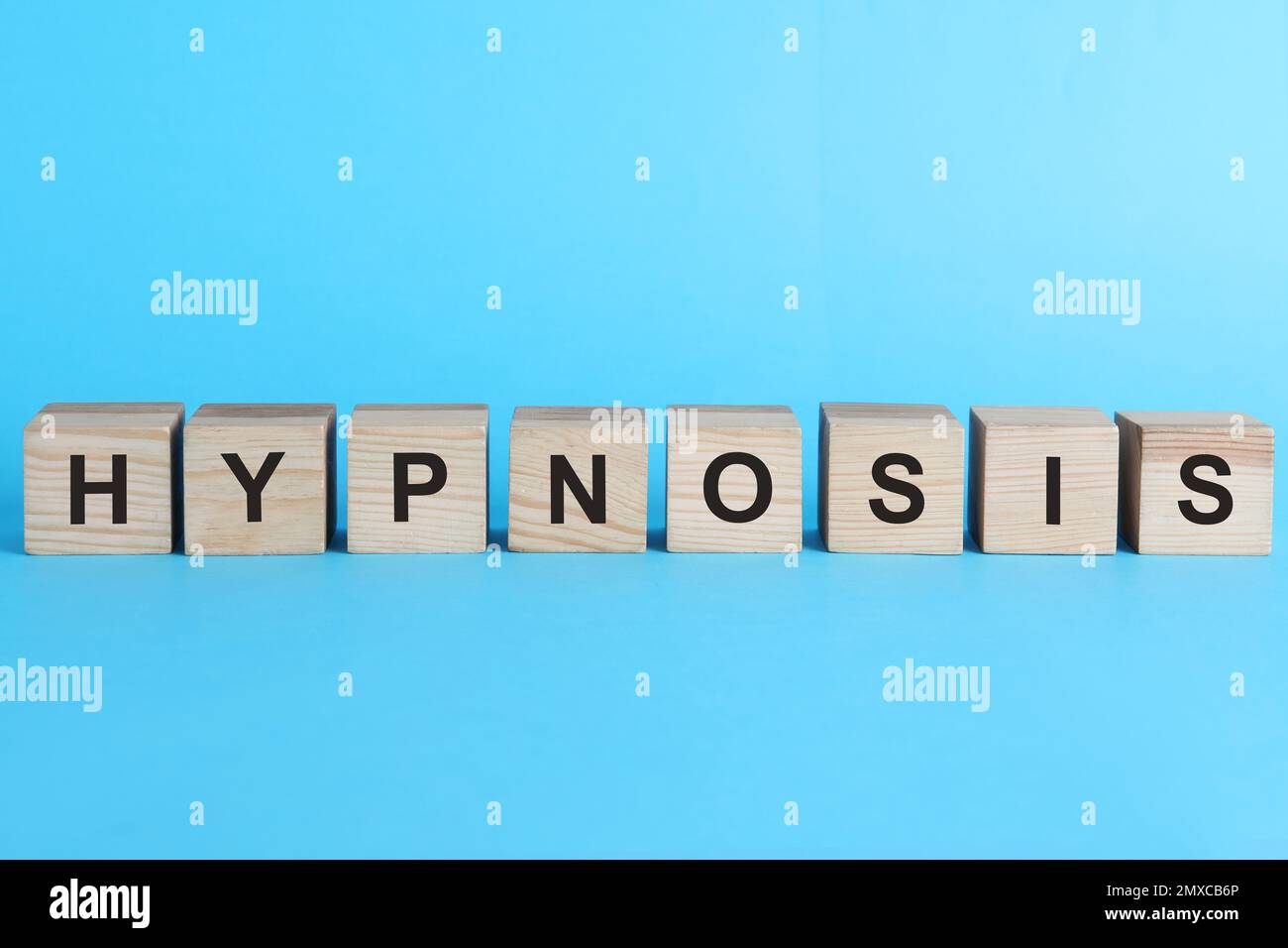 Wooden blocks with word HYPNOSIS on light blue background Stock Photo ...