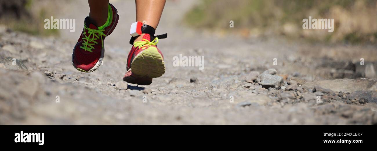 Trail running action close up of running shoes in action Stock Photo ...