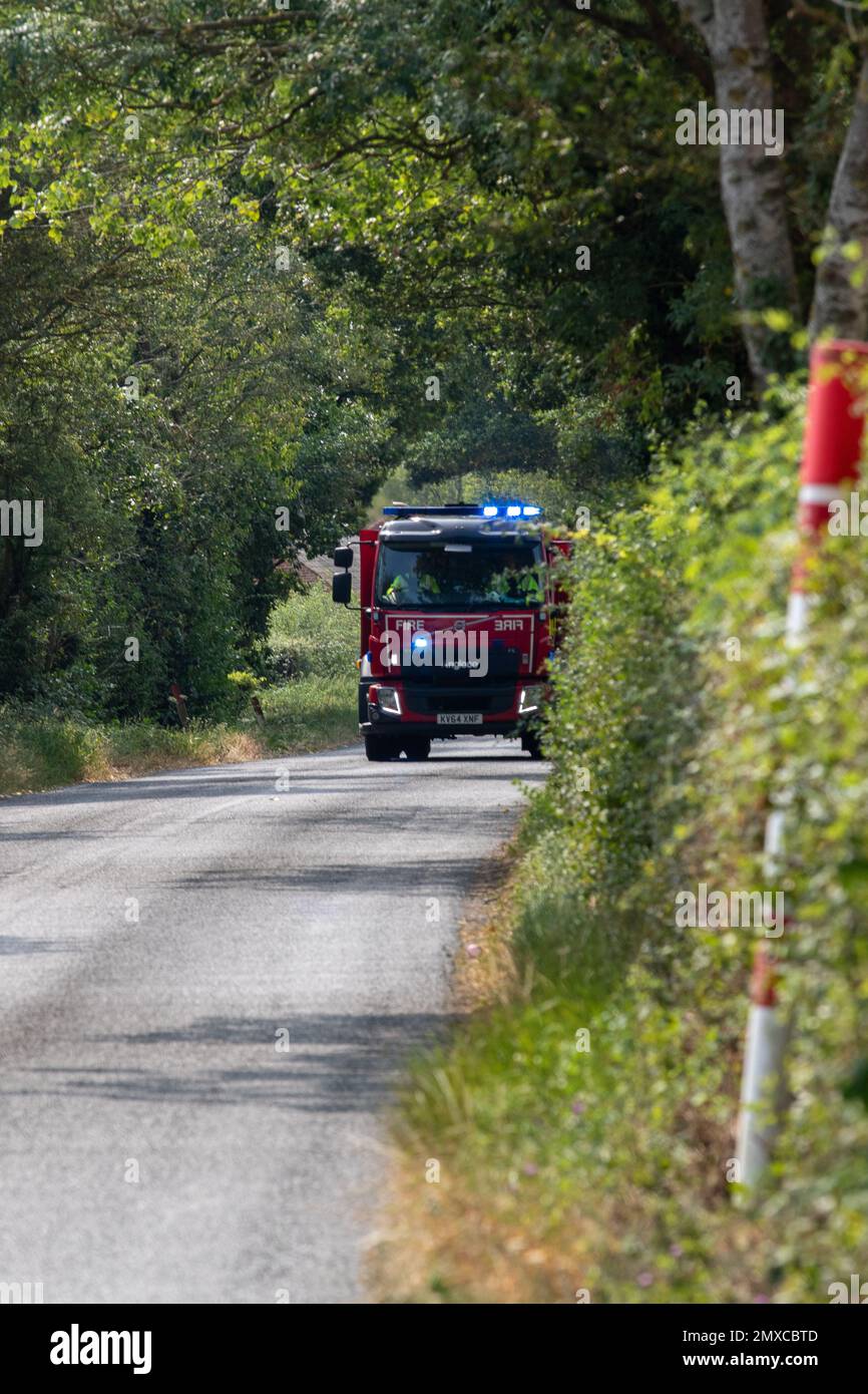 On a pleasant summer's day in rural Suffolk a fire engine attends a big ...
