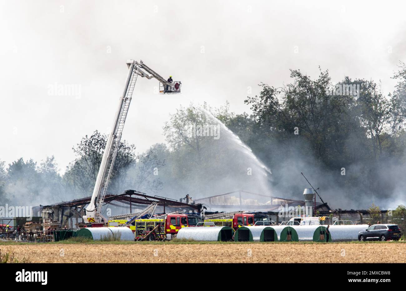 Smoke rising from a serious fire on a small industrial estate set in ...