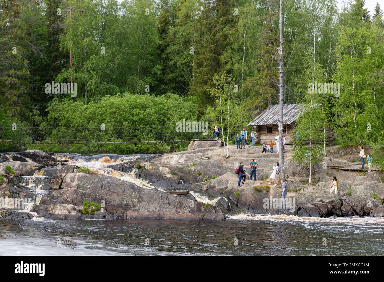 Ruskeala, Russia - June 11, 2021: Tourists visit natural waterfalls of ...