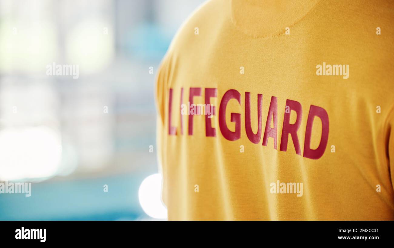 Lifeguard, closeup and swimming pool safety at indoor facility for ...