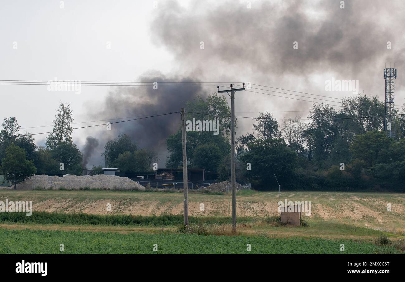 Smoke rising from a serious fire on a small industrial estate set in ...