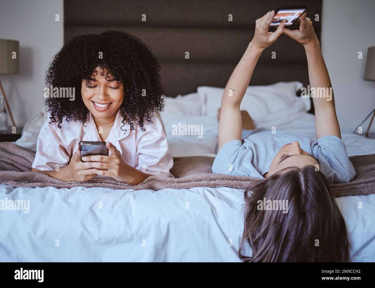 Video call, phone and friends with women at sleepover for communication ...