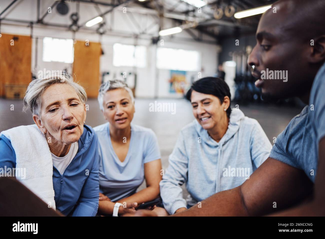 Fitness, senior women and personal trainer planning health, routine and ...