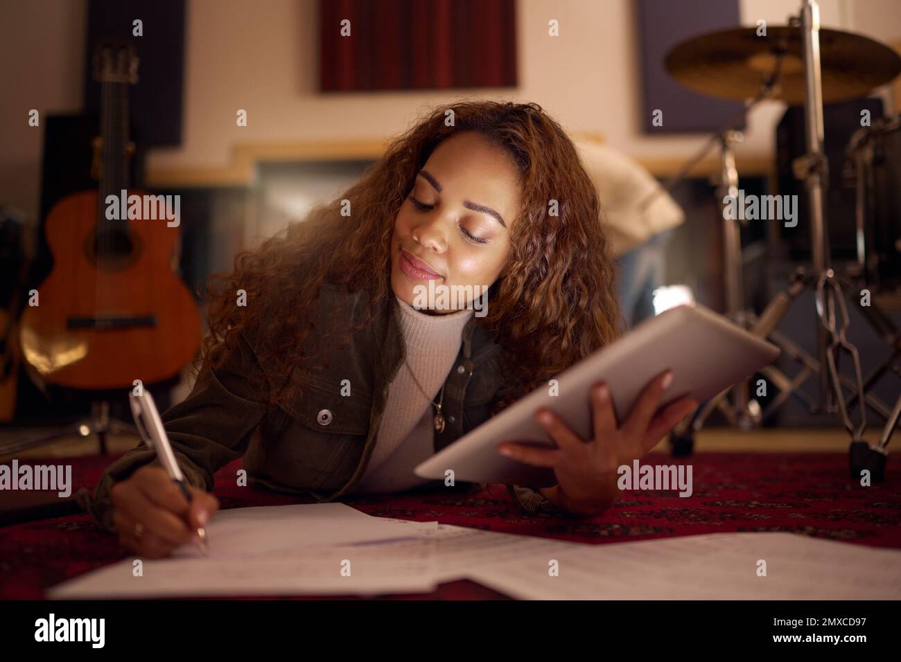 Digital tablet, songwriter and woman writing music, idea and ...