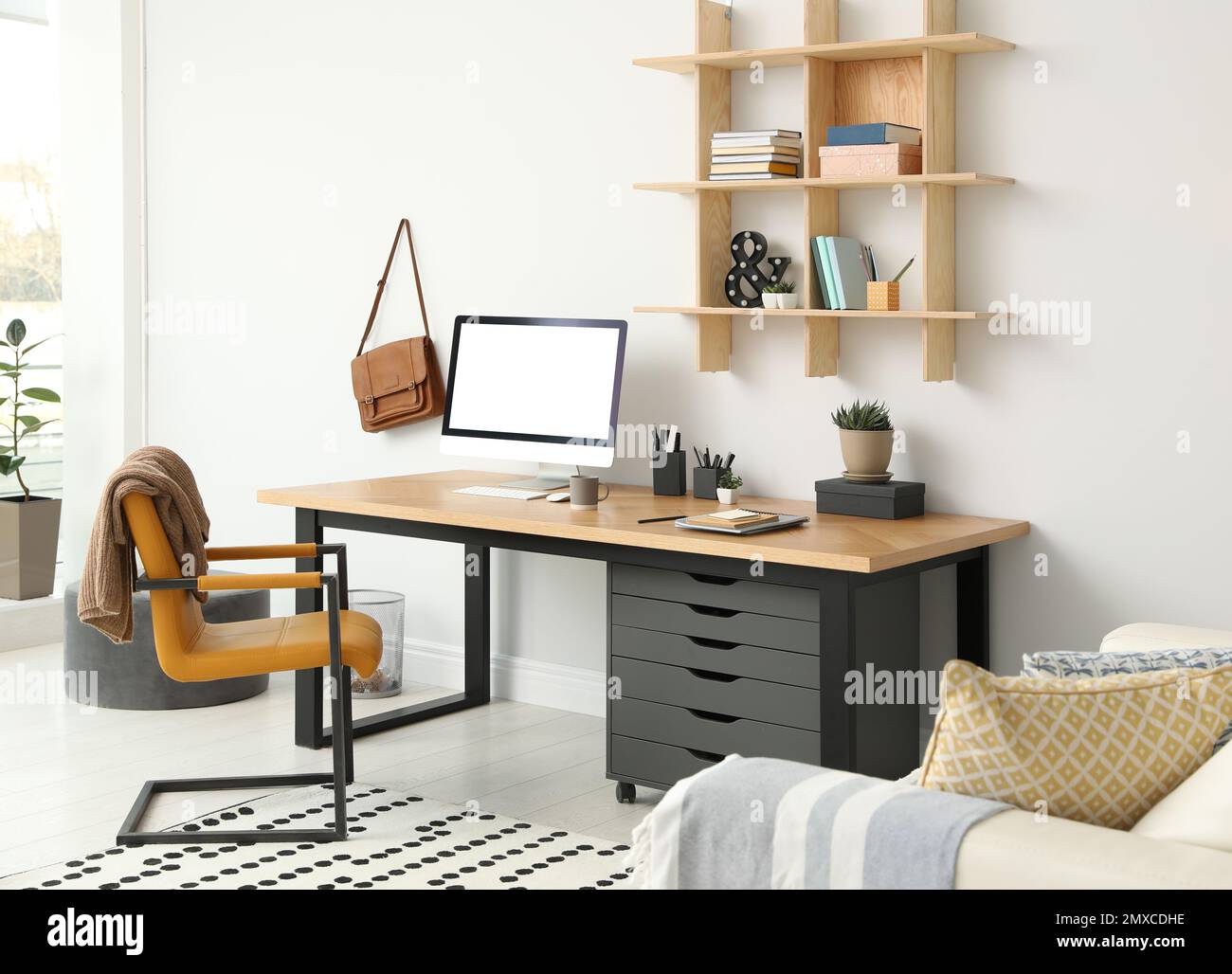 Stylish room interior with modern comfortable workplace Stock Photo - Alamy