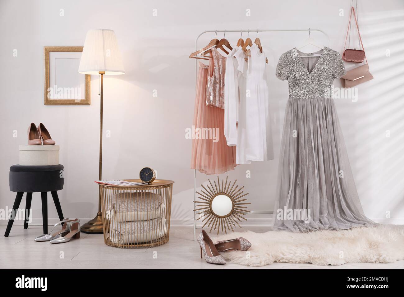 Rack with stylish women's clothes indoors. Interior design Stock Photo ...