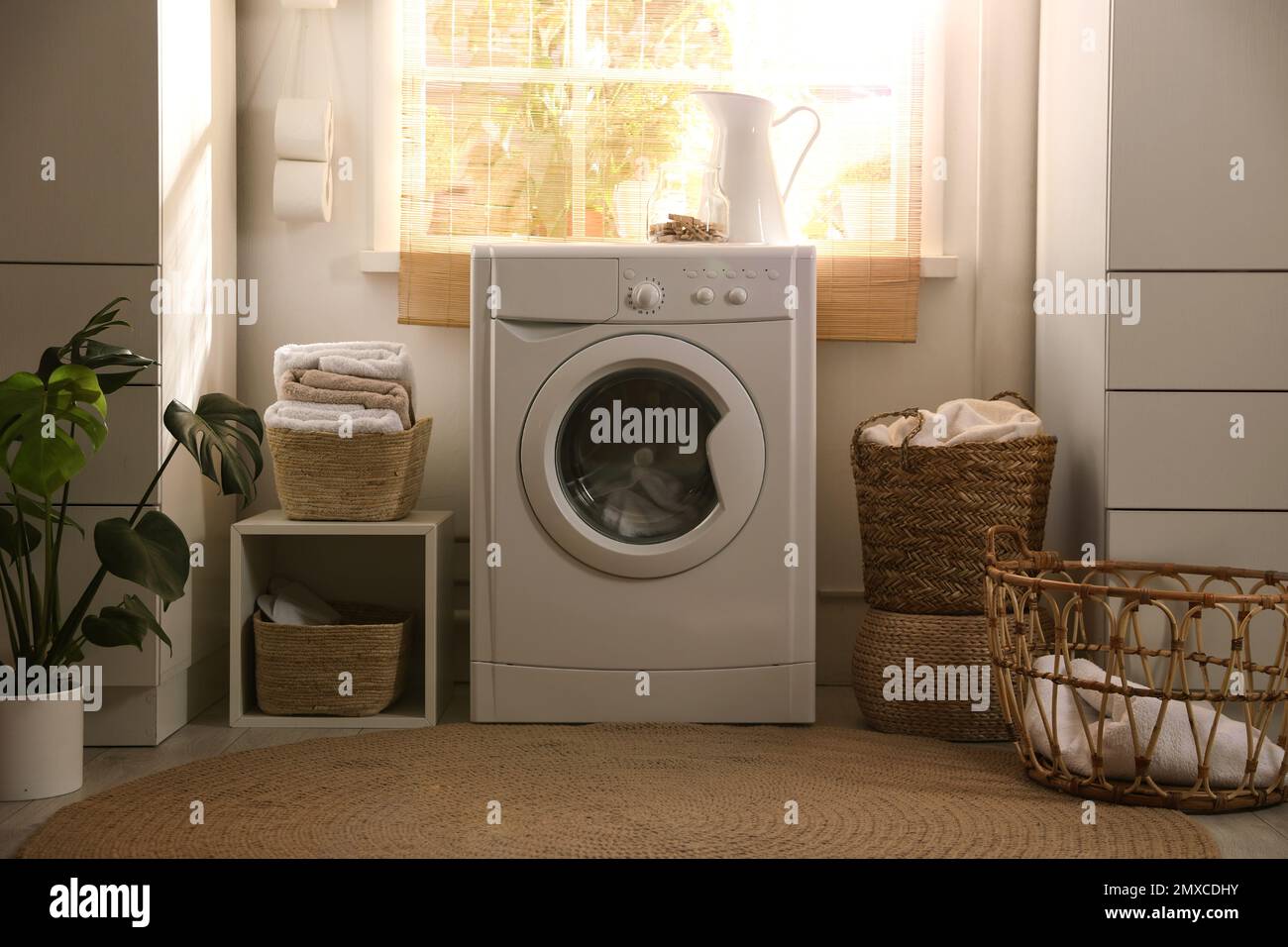 Stylish room interior with washing machine. Design idea Stock Photo - Alamy