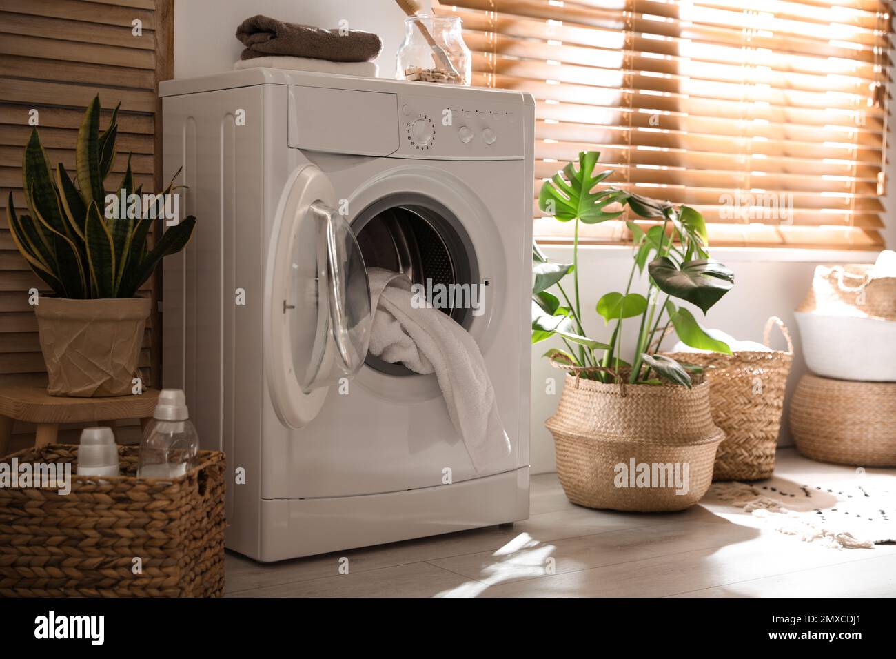 Stylish room interior with washing machine. Design idea Stock Photo - Alamy