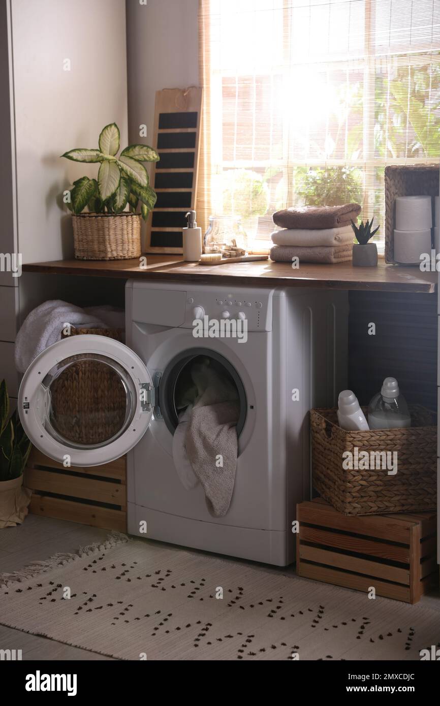 Stylish room interior with washing machine. Design idea Stock Photo - Alamy