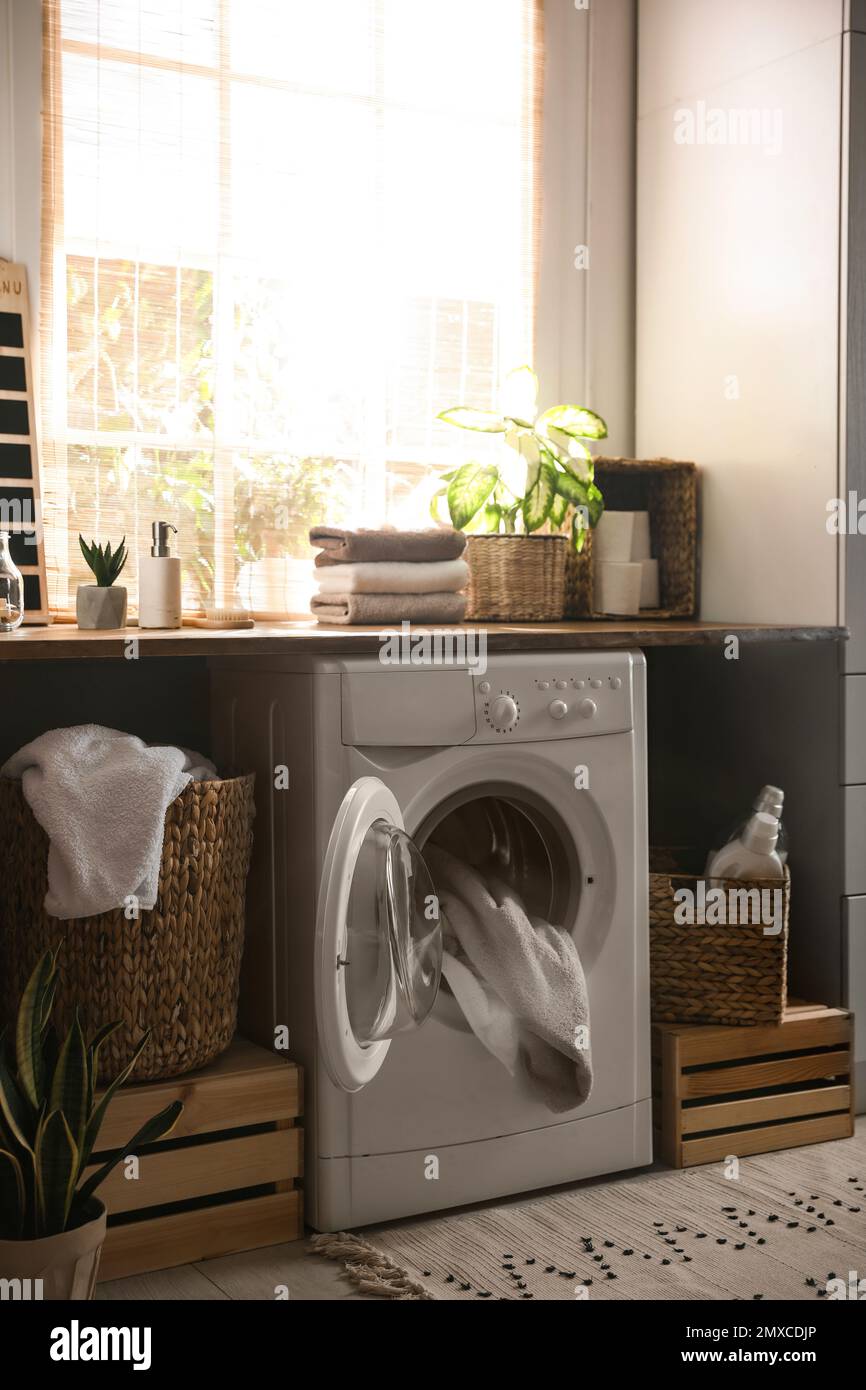 Stylish room interior with washing machine. Design idea Stock Photo - Alamy