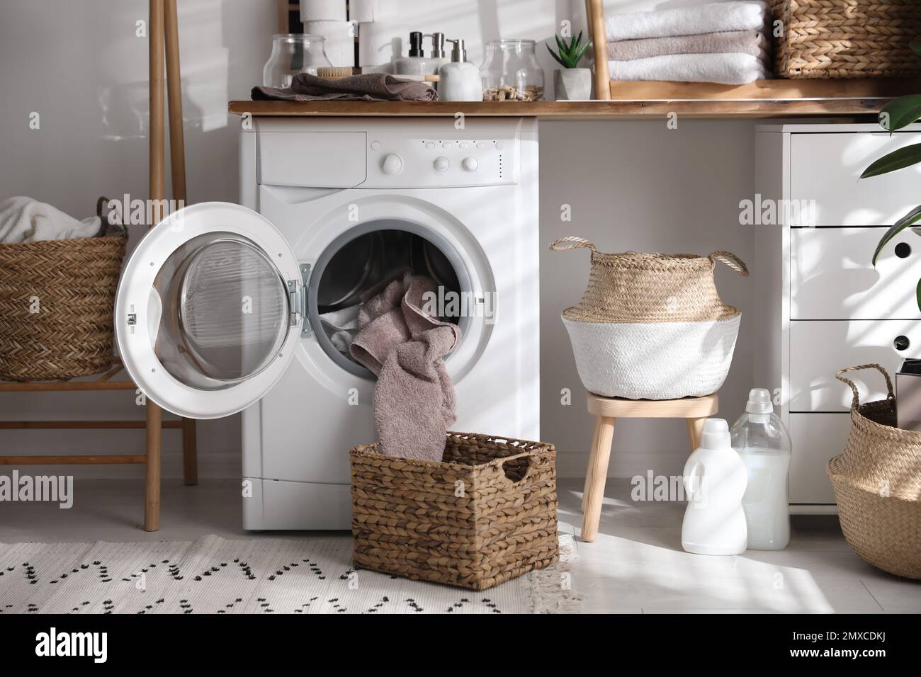 Stylish bathroom interior with modern washing machine Stock Photo - Alamy