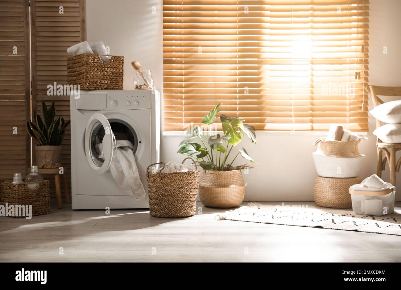 Stylish room interior with washing machine. Design idea Stock Photo - Alamy