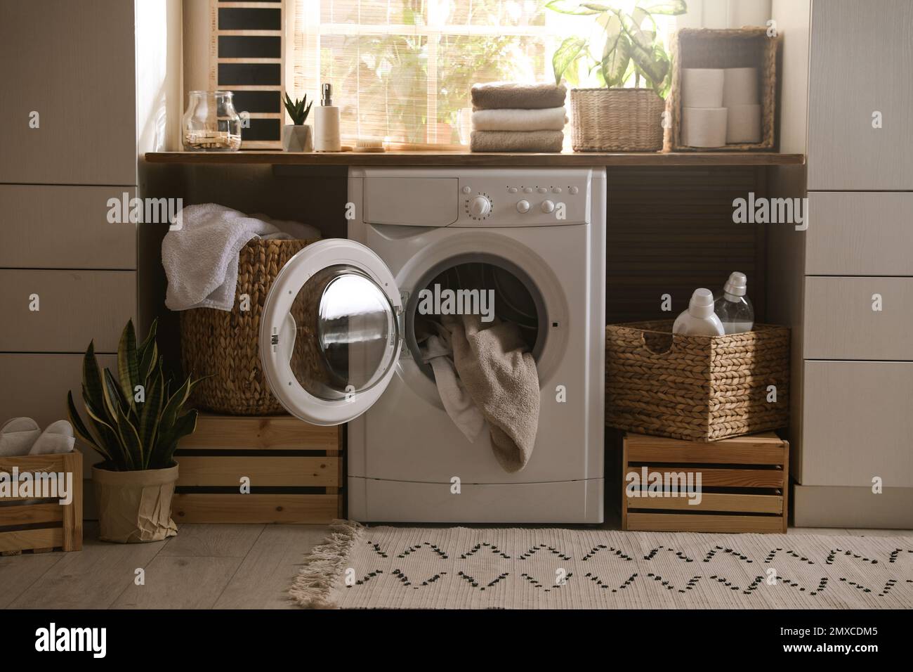 Stylish room interior with washing machine. Design idea Stock Photo - Alamy