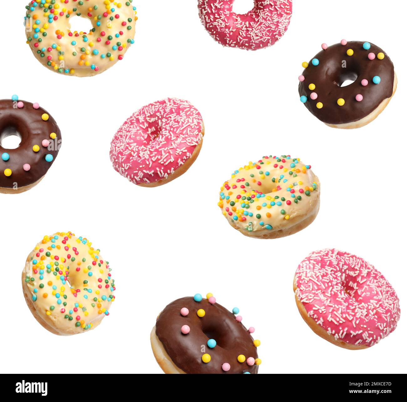 Set of falling delicious donuts on white background Stock Photo - Alamy