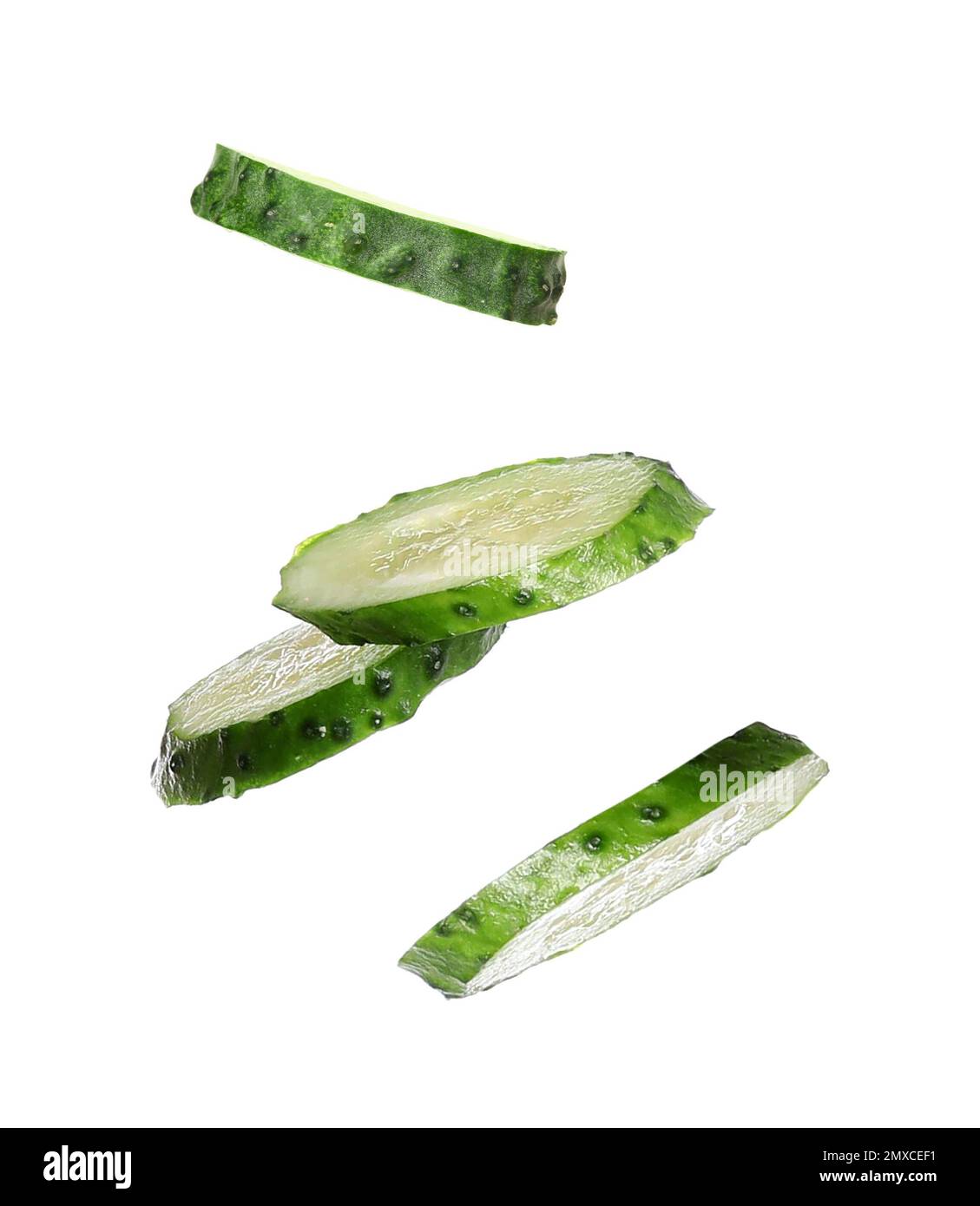 Set of flying fresh cucumber slices on white background Stock Photo - Alamy