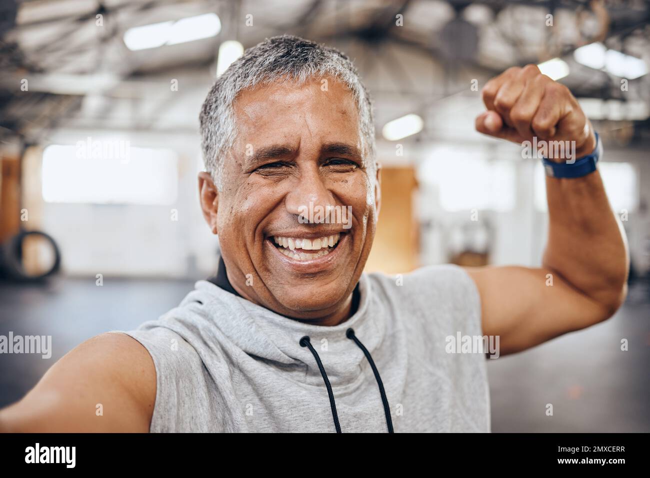 Muscle, exercise and selfie portrait of old man in gym show biceps for motivation, wellness and ...