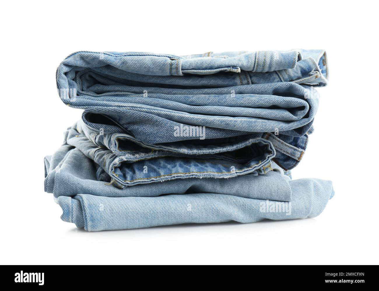 Stack of folded jeans isolated on white Stock Photo - Alamy