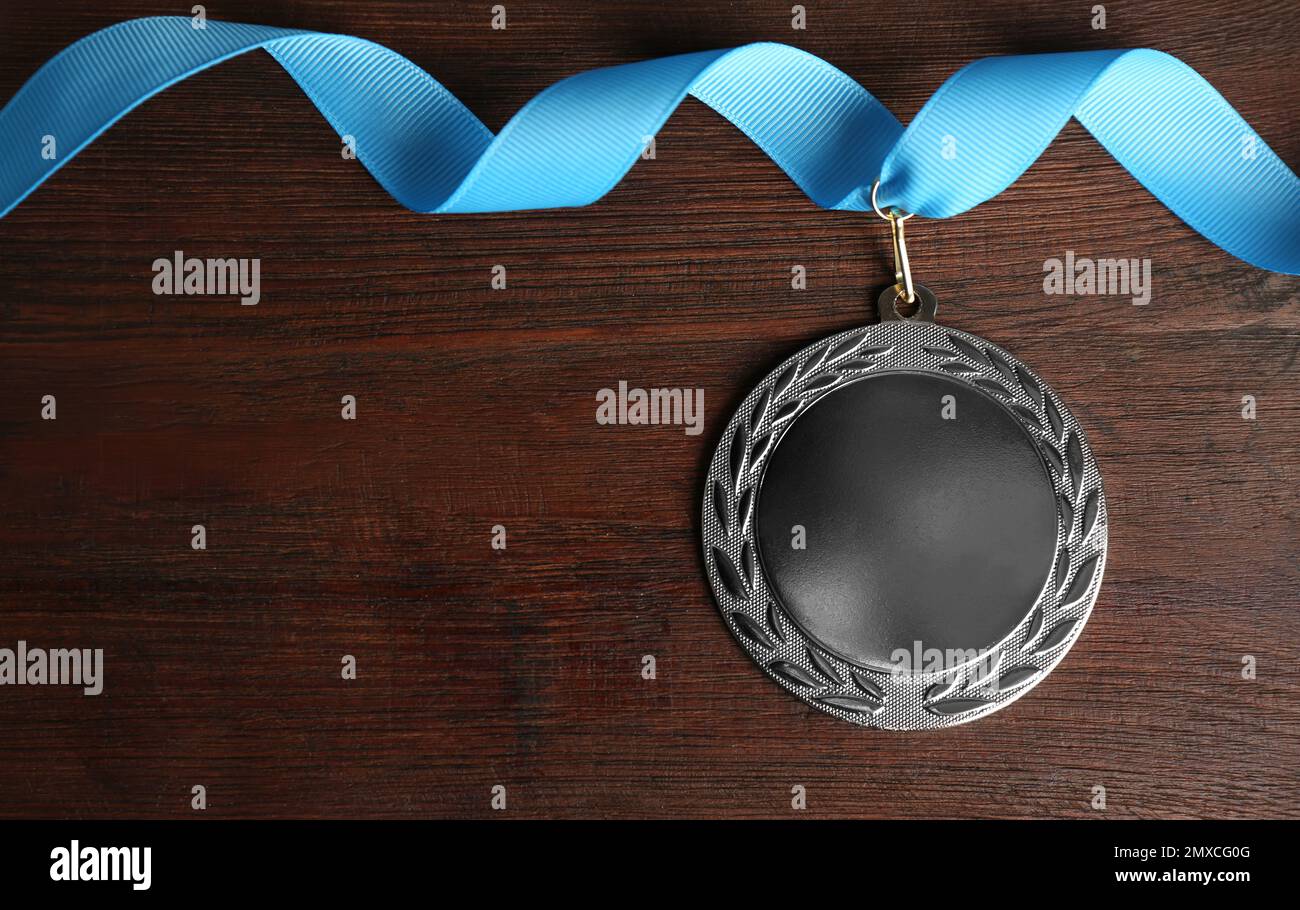 Silver medal on wooden background, top view. Space for design Stock ...