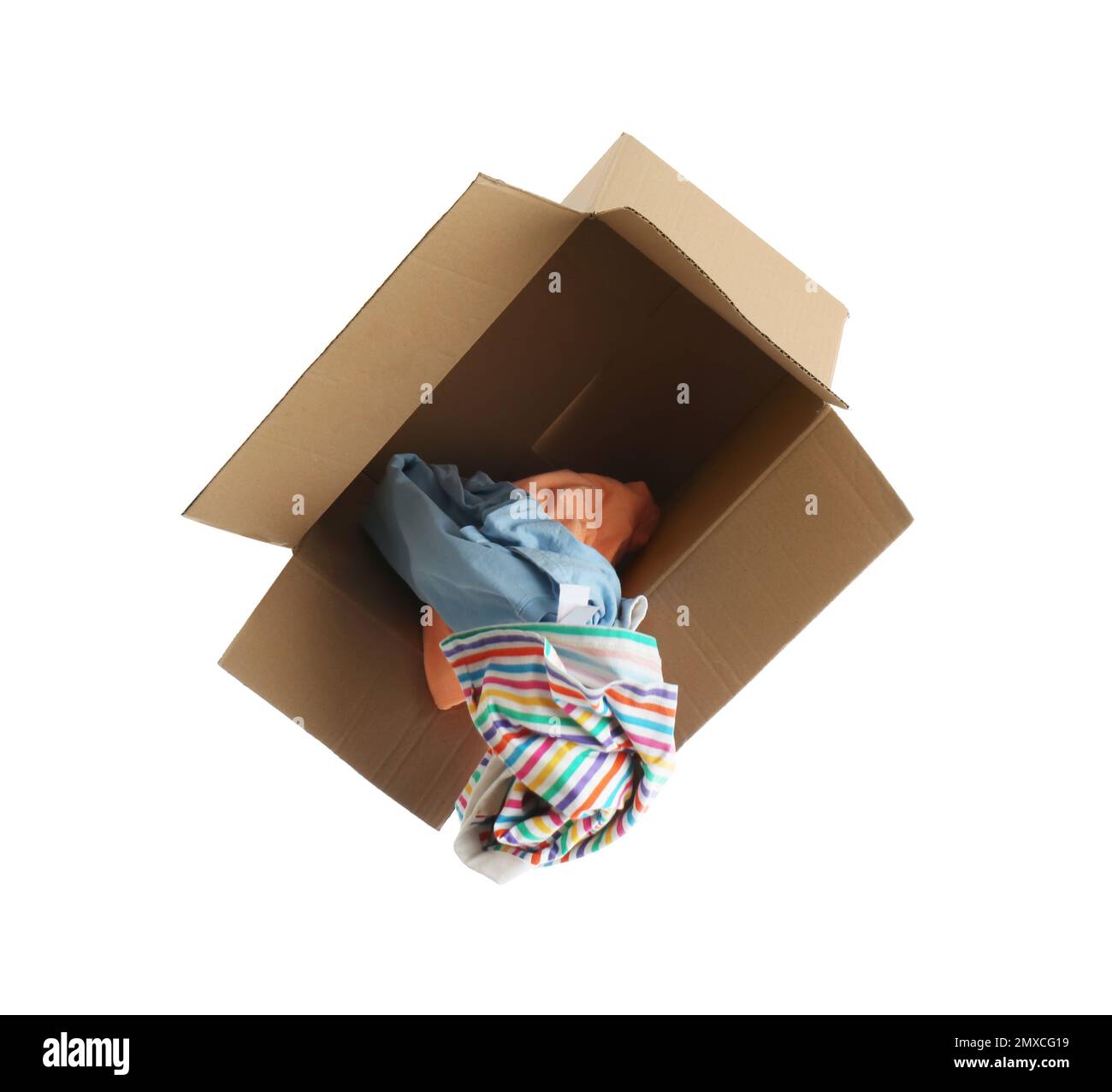 Overturned cardboard box with clothes isolated on white Stock Photo - Alamy