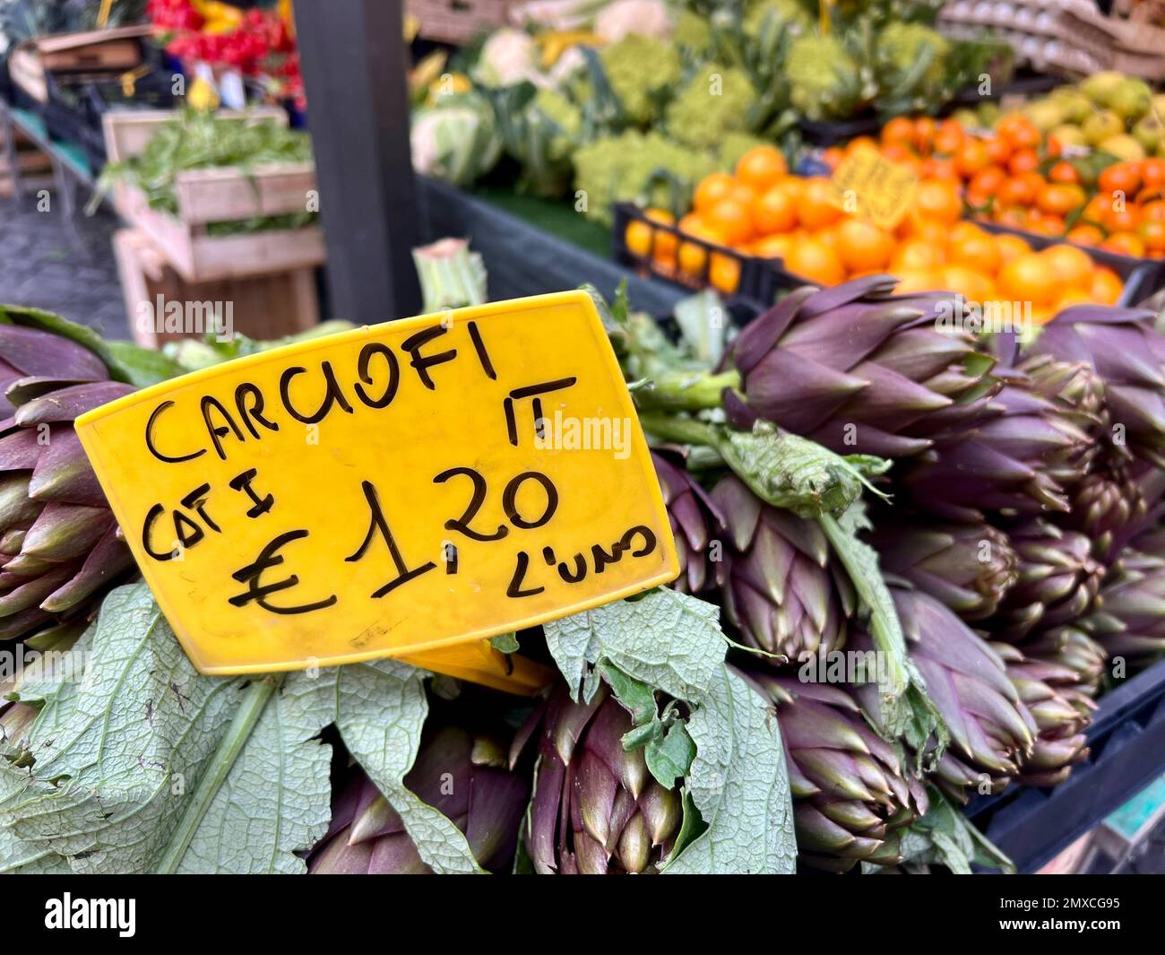 market, italian price tag on fresh artichokes with selective focus in ...