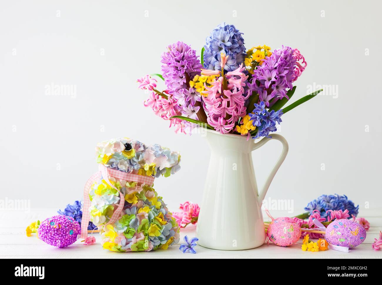 Easter still life with lilac and pink hyacinths, Easter eggs and bunny ...