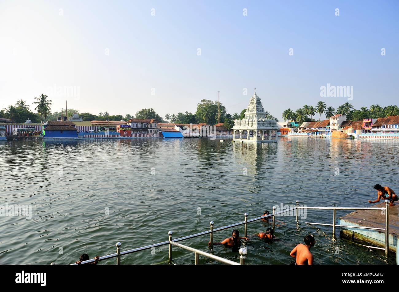 Pilgrim bathing in religious water tank at Sthanumalaya Temple at ...
