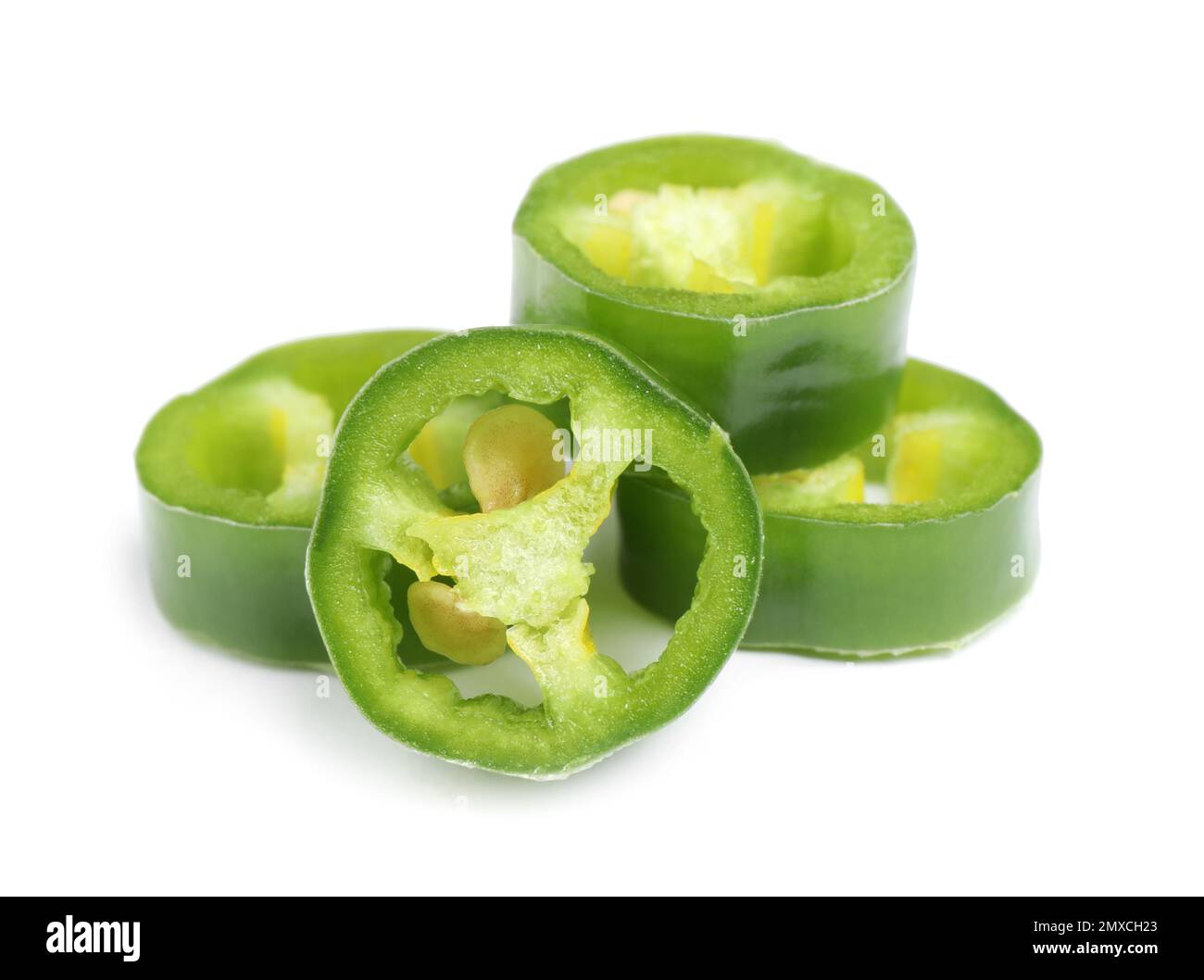 Cut green hot chili pepper on white background Stock Photo - Alamy