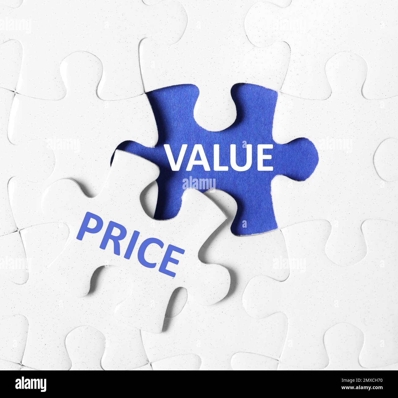 Puzzle with phrase PRICE VALUE on blue background, top view Stock Photo ...