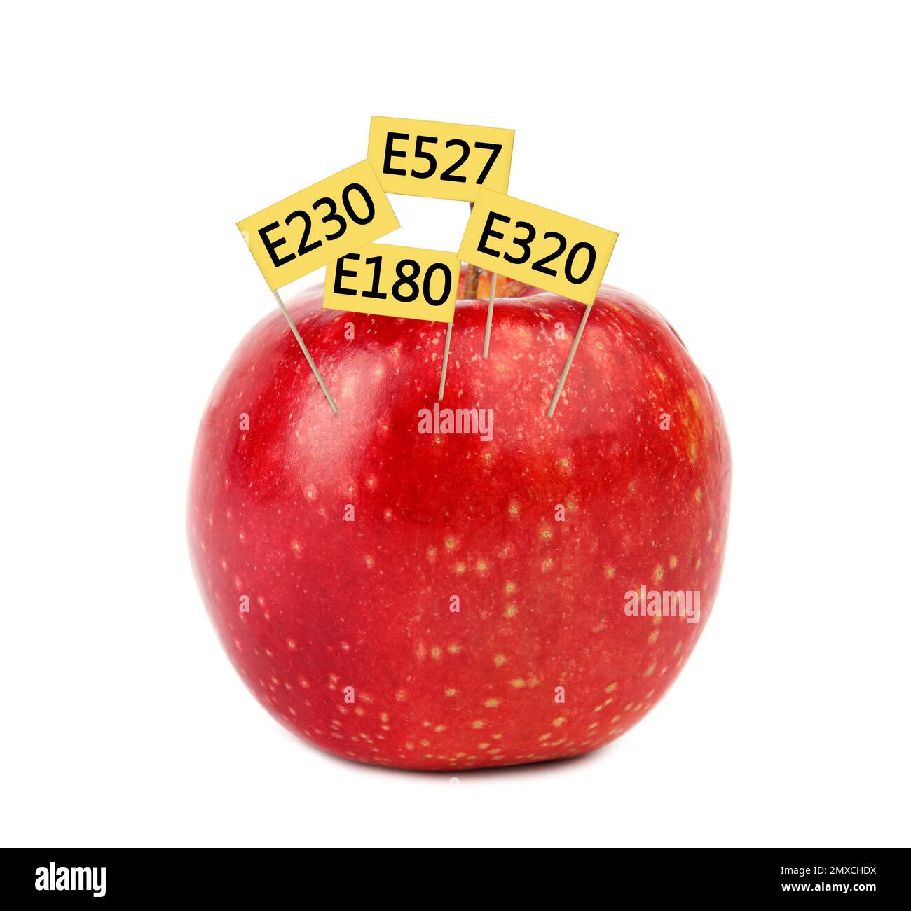 Fresh apple with E numbers isolated on white. Harmful food additives ...