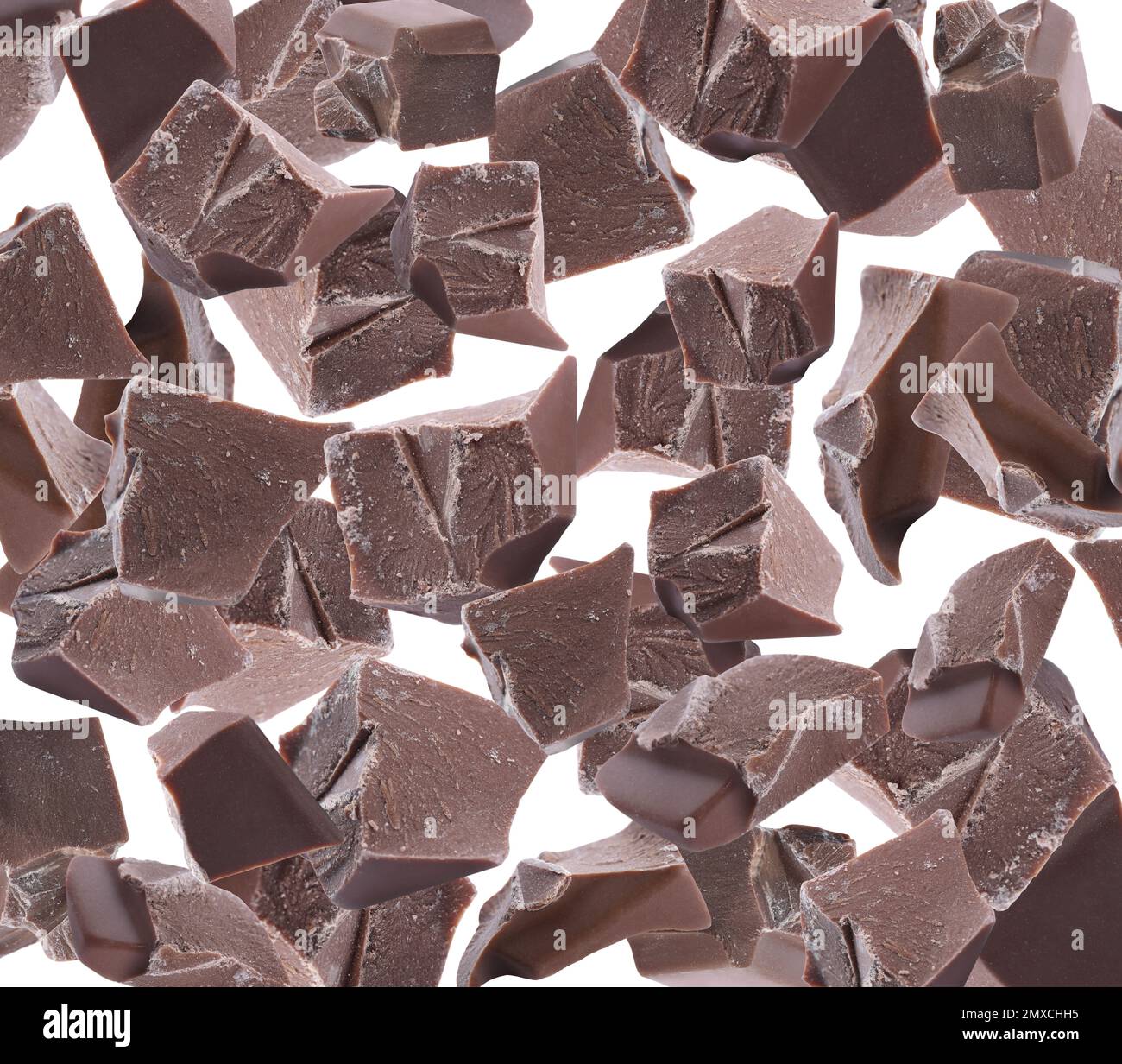Delicious chocolate chunks falling on white background Stock Photo - Alamy