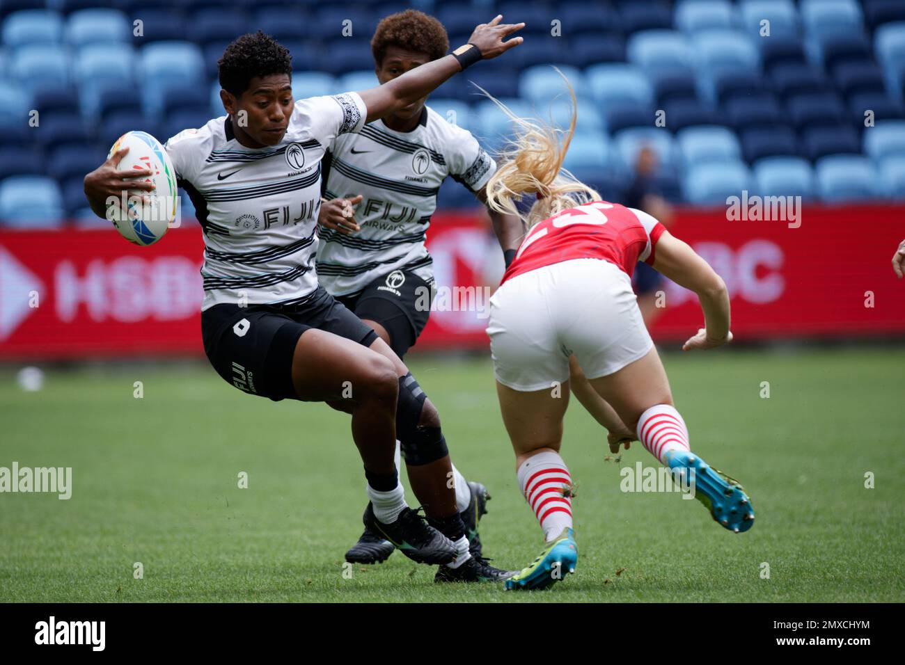 Ana Maria Naimasi of Fiji side steps Heather Cowell of Great Britain ...