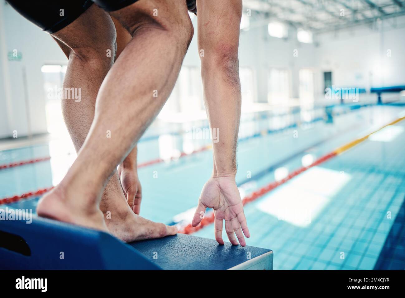 Sports, swimming and man on diving board by pool for training, exercise ...