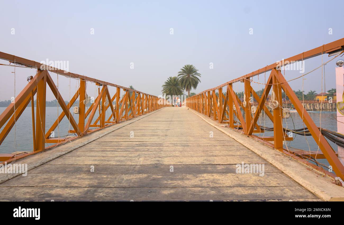 Wooden bridge crossing water hi-res stock photography and images - Alamy