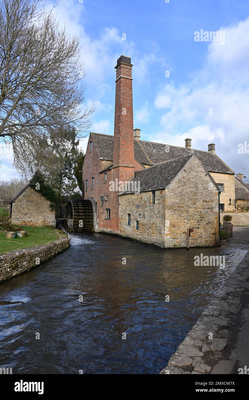 The Old Mill which stands on the River Eye in the Cotswold village of ...