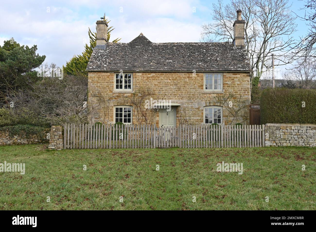 A traditionally built house in the Cotswold village of Wyck Rissington ...