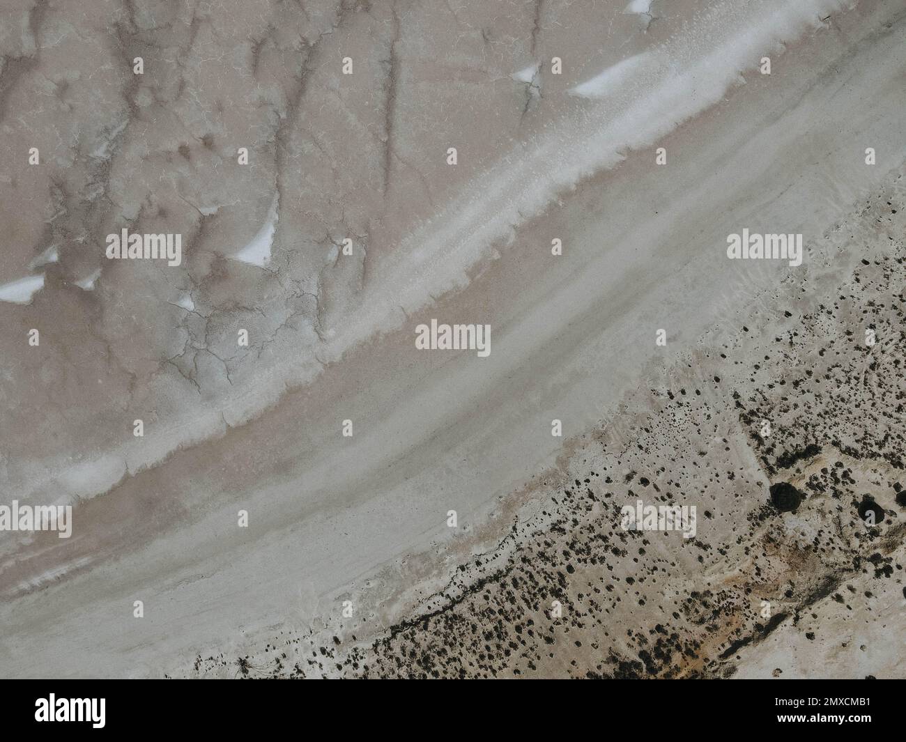 An aerial video of a dry empty field on a sunny day with unique ...