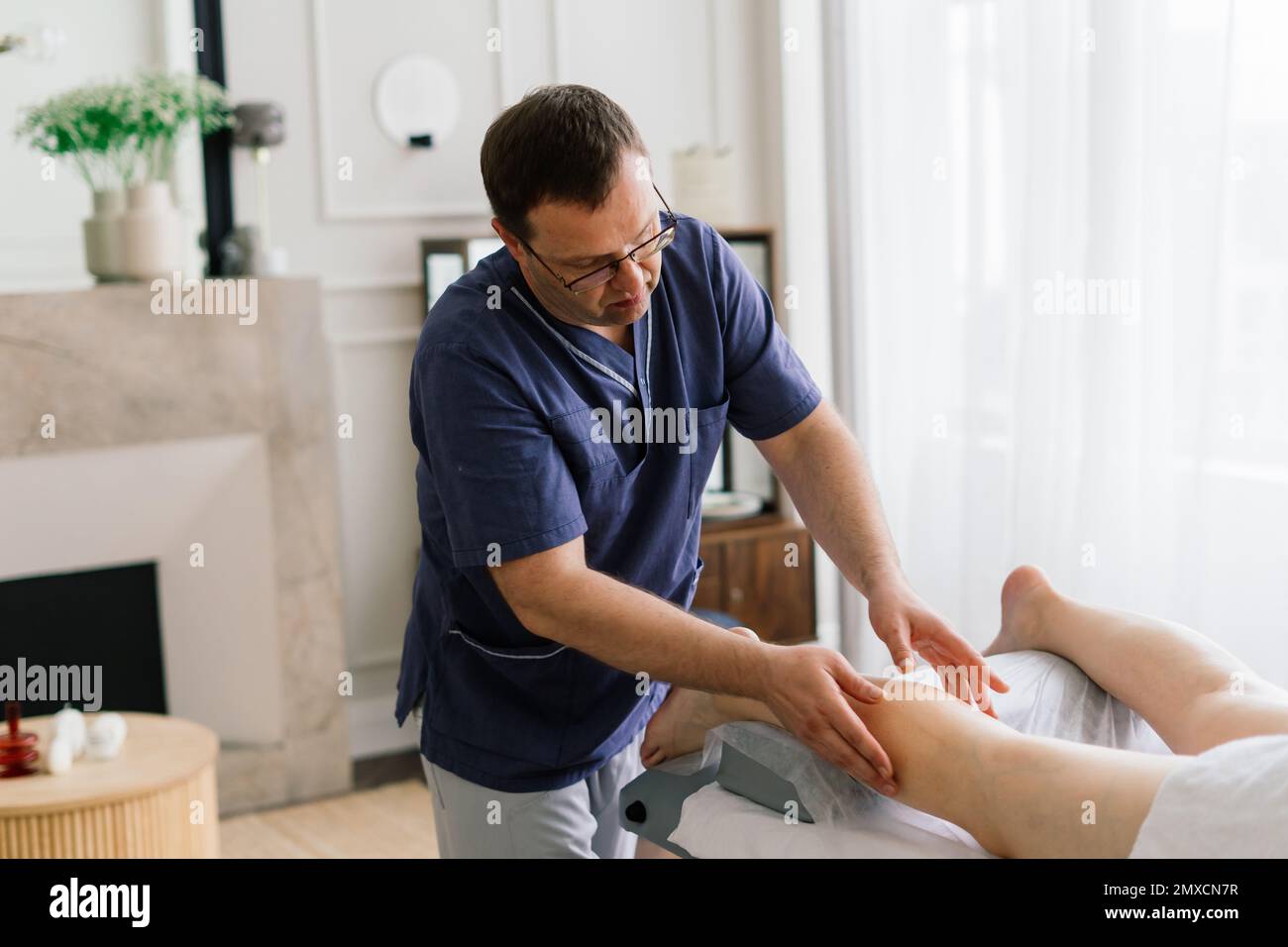 Young fat woman getting massage treatment in day spa cabinet Stock ...