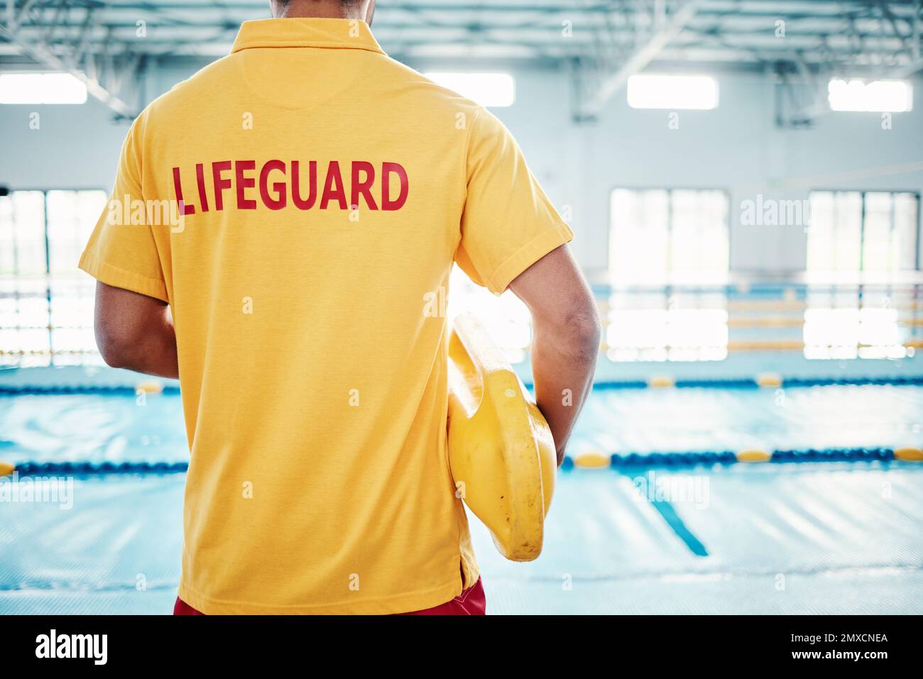 Security, safety or lifeguard by a swimming pool to help rescue the ...